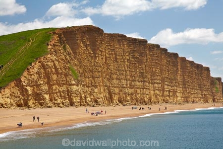 People on beach by West Bay Cliffs, Jurassic Coast World Heritage Site ...