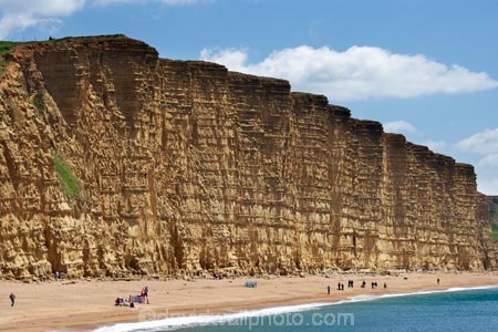People on beach by West Bay Cliffs, Jurassic Coast World Heritage Site ...