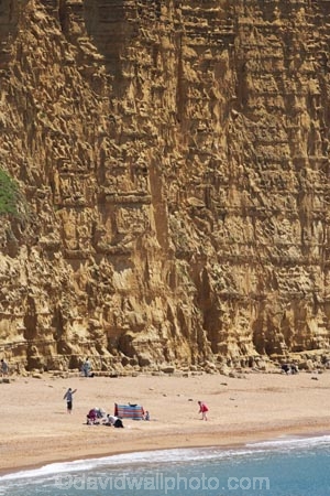 People on beach by West Bay Cliffs, Jurassic Coast World Heritage Site ...