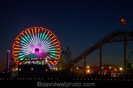 Ferris wheel and roller coaster at dusk, Pacific Park, Santa Monica ...